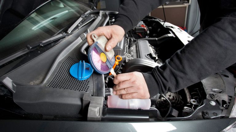 Radiator Coolant Overflow Tank: Purpose & Maintenance